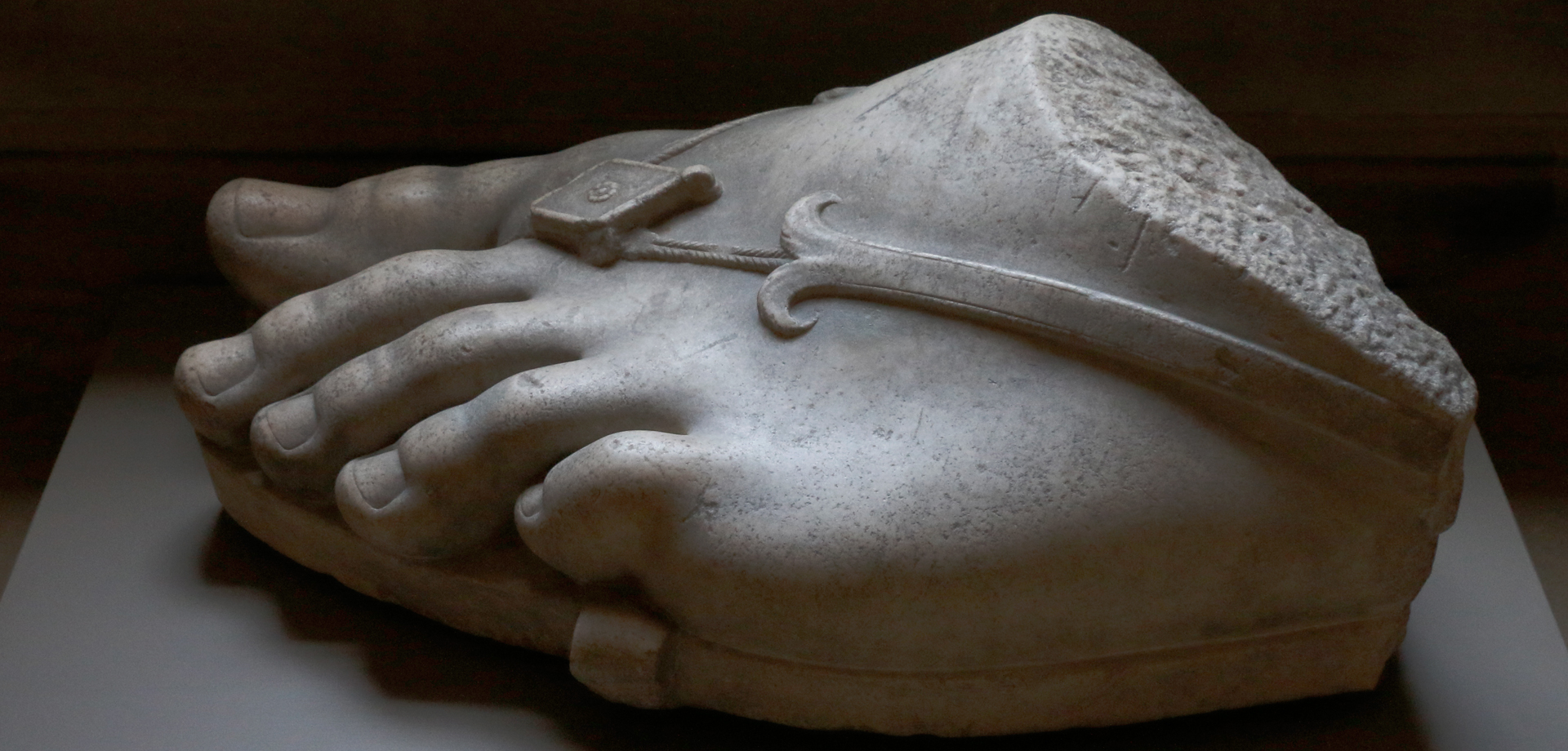 Marble Foot wearing a Sandal